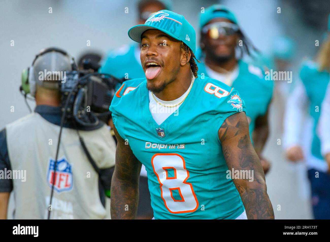 Miami Dolphins safety Jevon Holland (8) runs onto the field with the ...