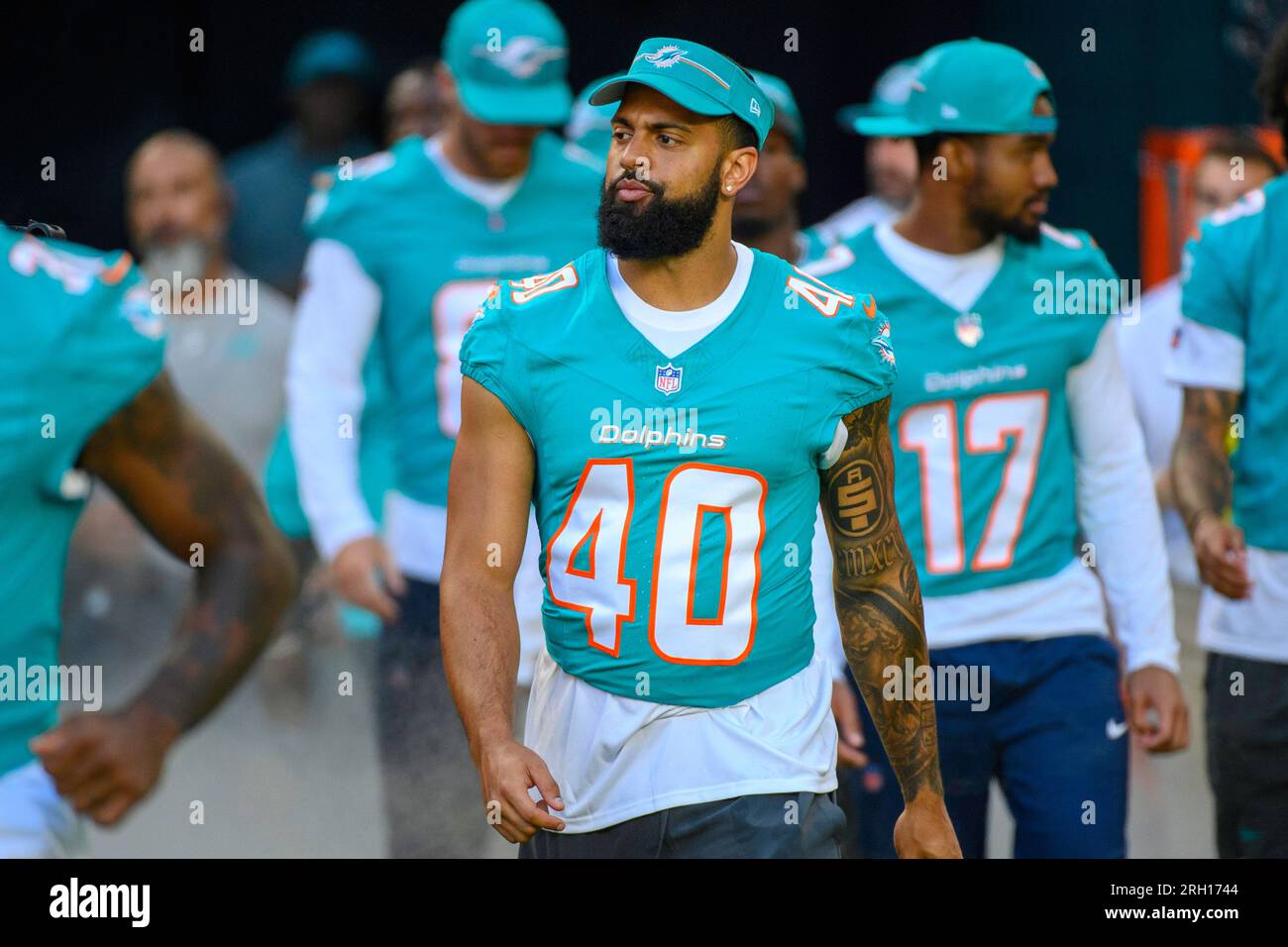 Miami Dolphins cornerback Nik Needham (40) walks onto the field with ...