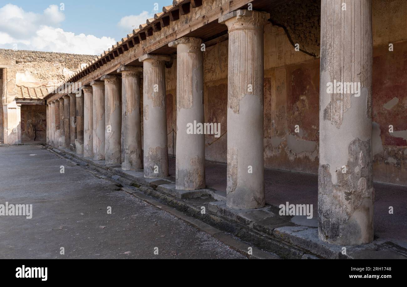Columns and courtyard in the ancient ruined city of Pompeii Stock Photo ...