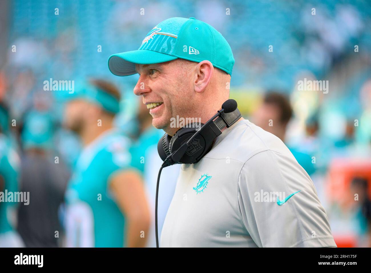 Miami Dolphins offensive line coach Butch Barry smiles on the sidelines ...