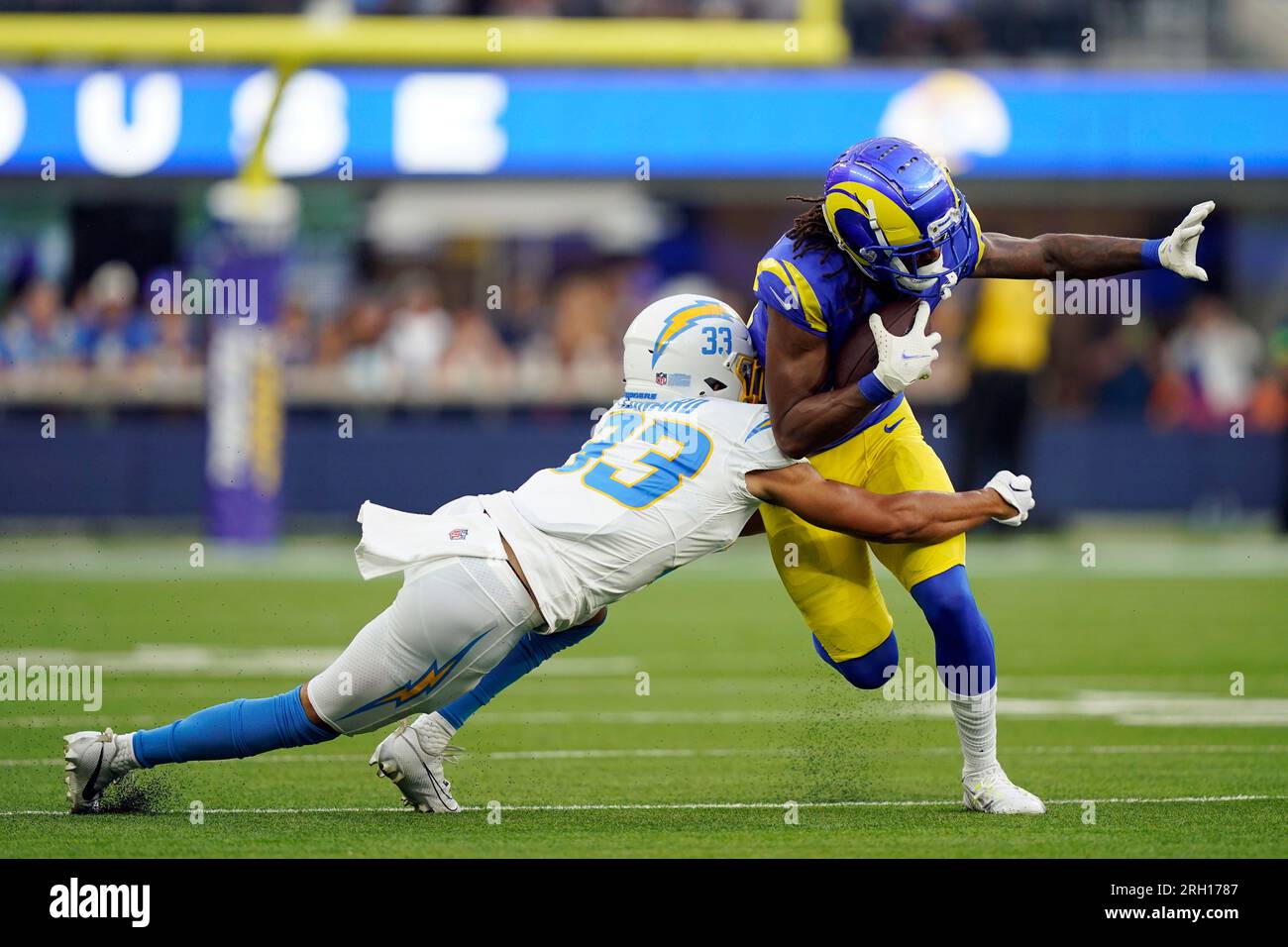 Los Angeles Rams wide receiver Demarcus Robinson, right, is tackled by ...