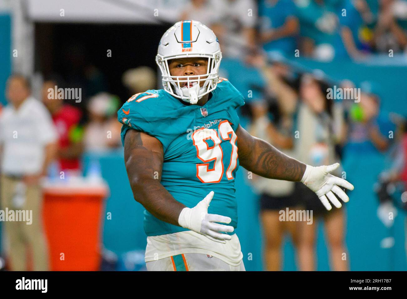 Miami Dolphins defensive tackle Jaylen Twyman (97) reacts after sacking ...