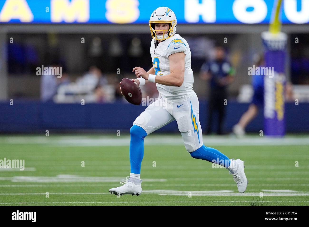 Los Angeles Chargers quarterback Easton Stick rolls out during the ...