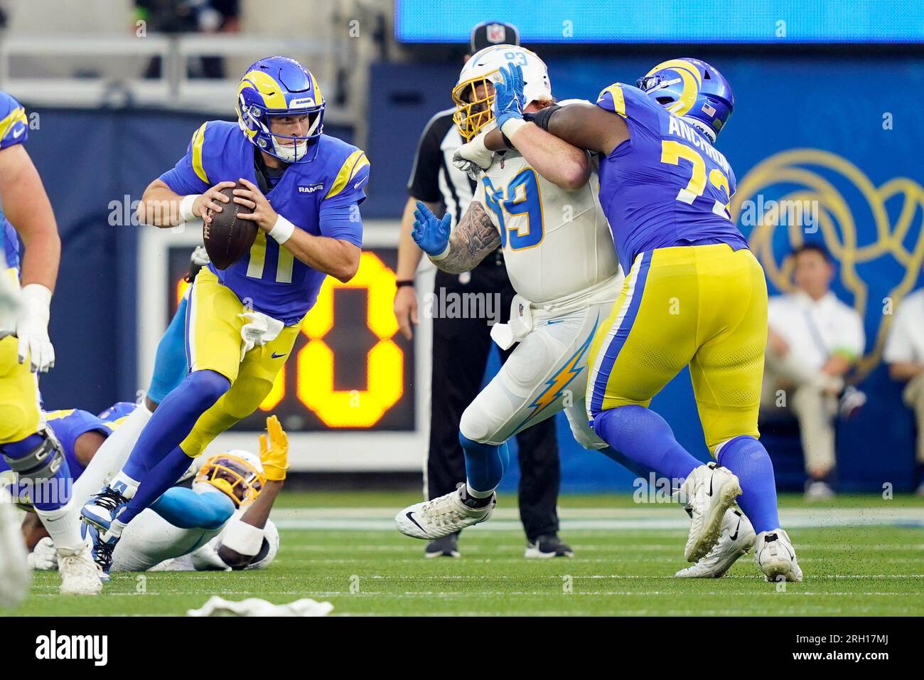 Los Angeles Rams quarterback Brett Rypien breaks away from pressure ...