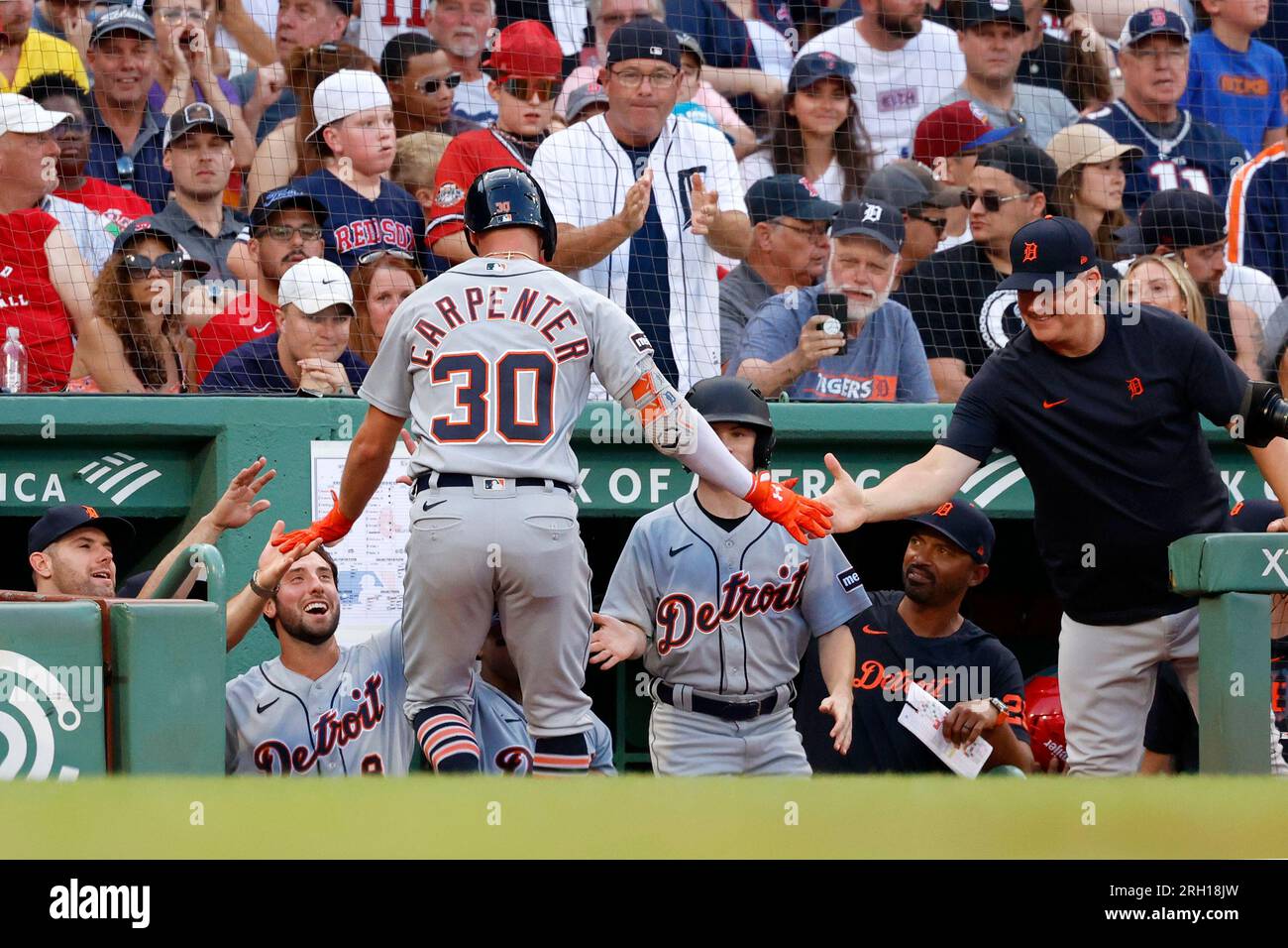 Detroit Tigers' Kerry Carpenter (30) is congratulated at the dugout ...