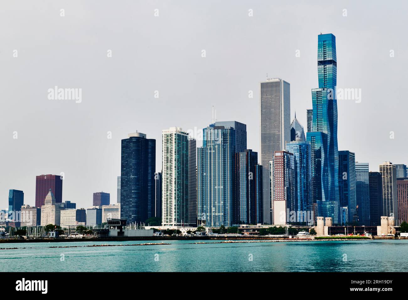 Chicago Cityscape from Chicago River Waterfront at Dusk. Small boats ...