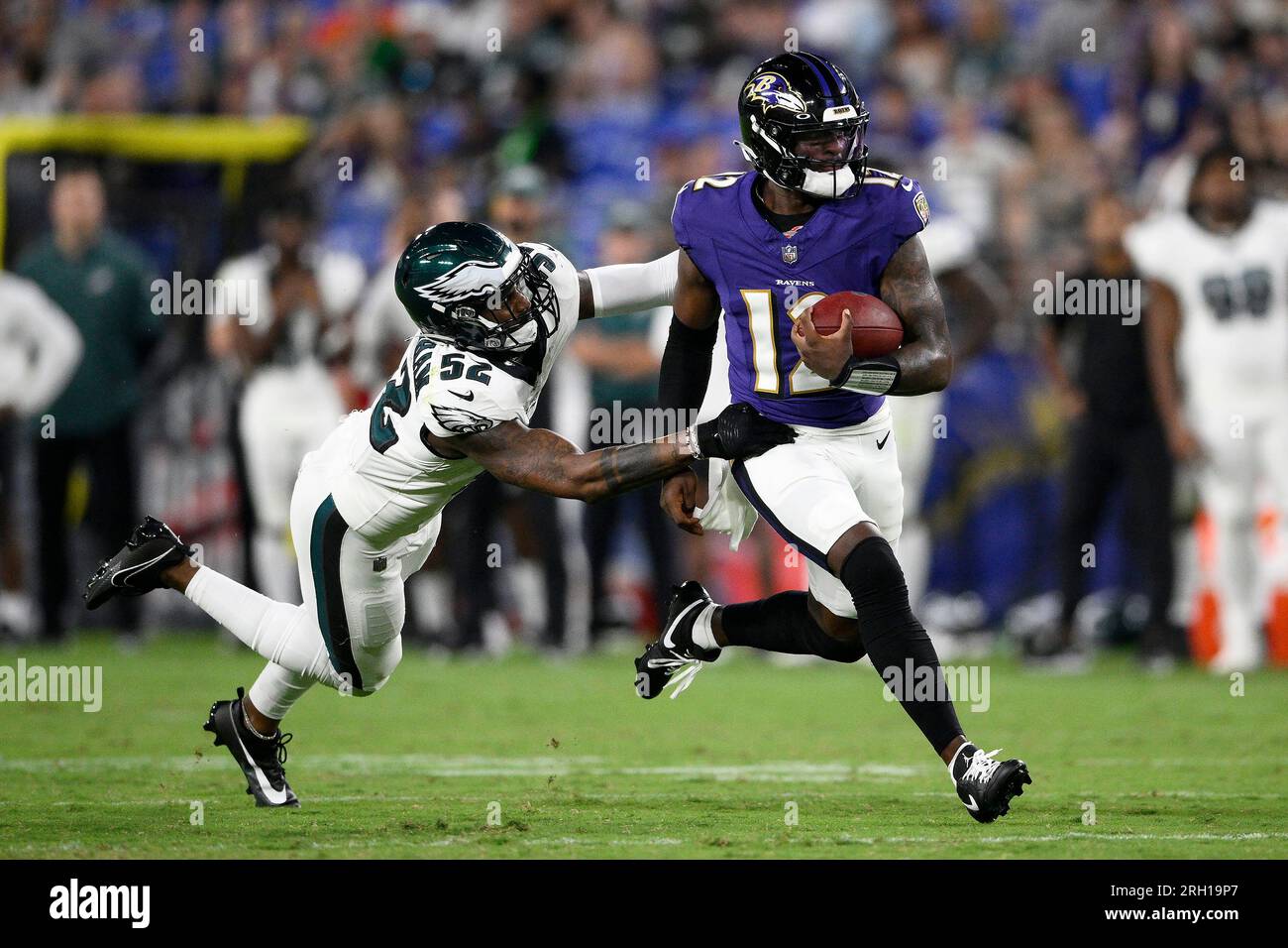 Baltimore Ravens quarterback Anthony Brown Jr., right, runs against ...
