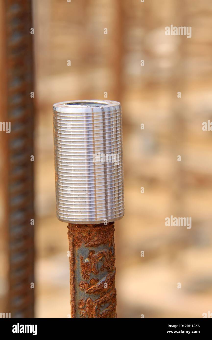 brown rebar and white threads interface in the workshop Stock Photo - Alamy