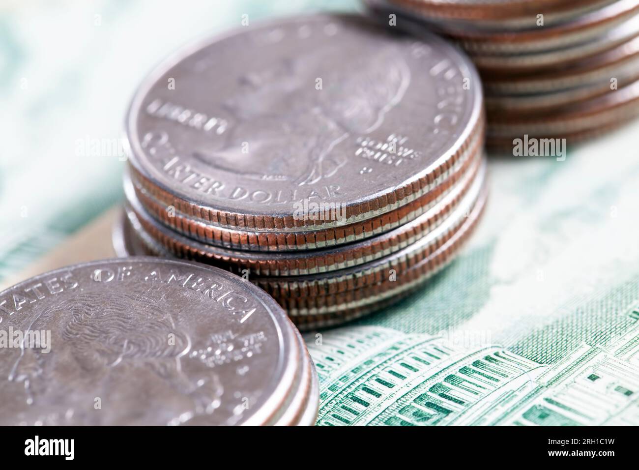 American coins a quarter of an American dollar stacked together, a ...