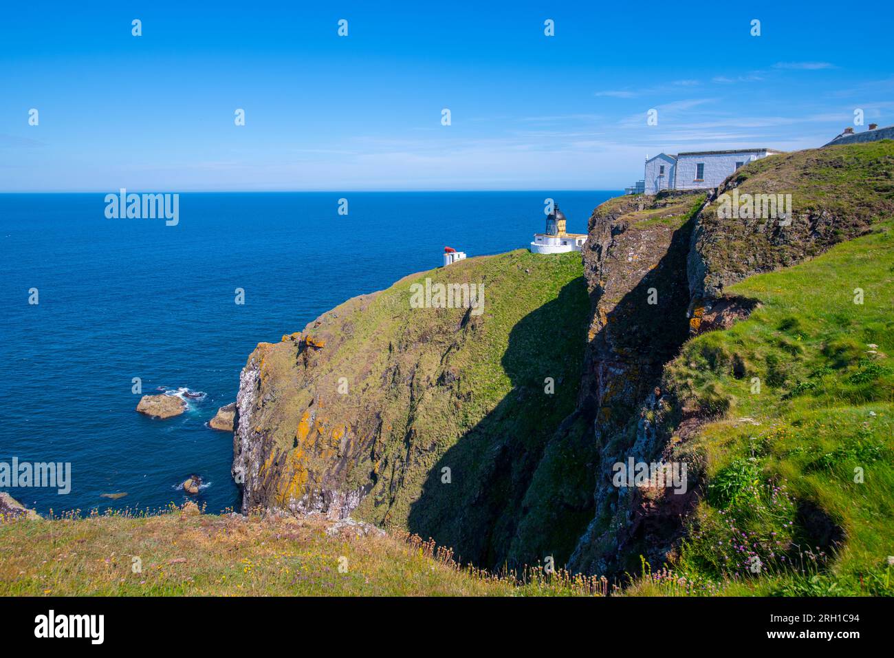 St. Abbs Lighthouse and coastal cliffs aerial view in summer near ...