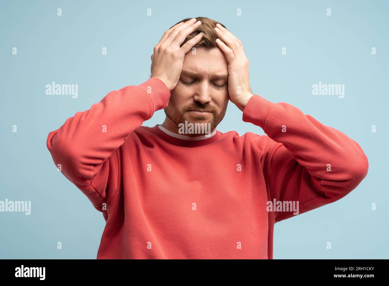 Portrait of sad man having life troubles holding head with suffering ...