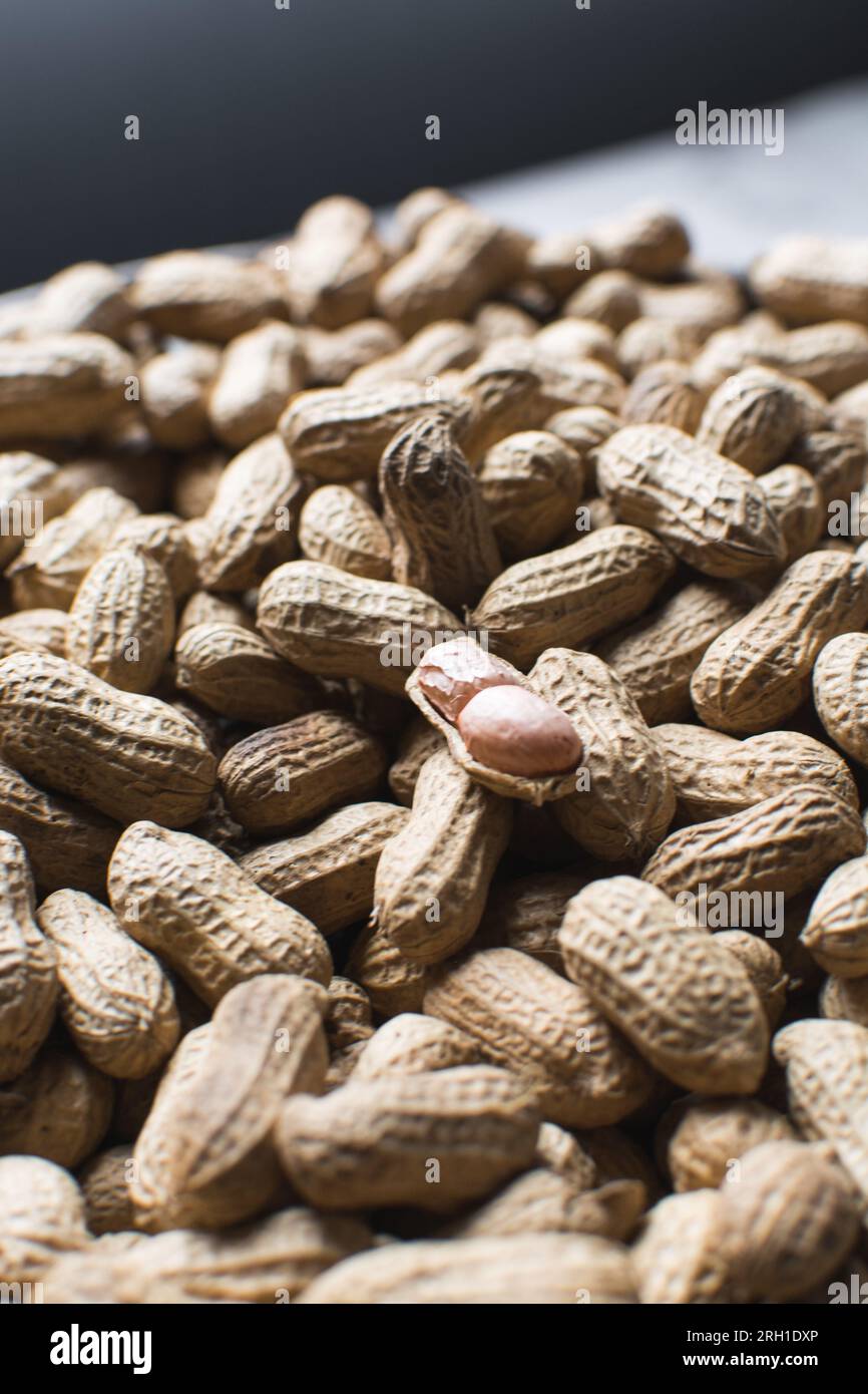 Top view of groundnuts in the shell, flatlay of shelled and unshelled ...