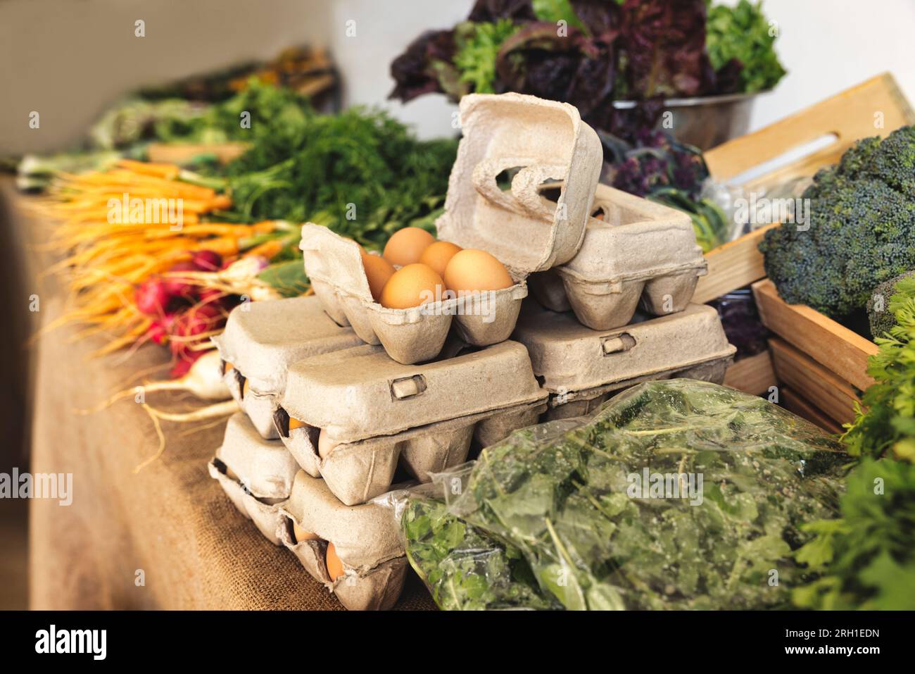 flea market stall with eggs and various fresh vegetables in a ...