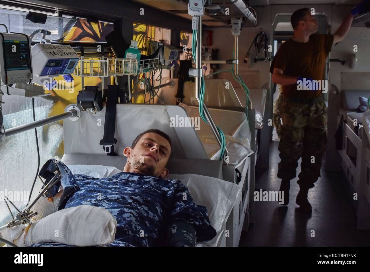 Wounded Ukrainian soldier is evacuated in a special medical bus ...