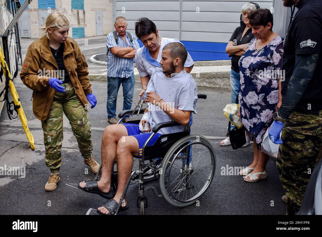 Volunteers of Hospitallers paramedic organisation move an injured ...