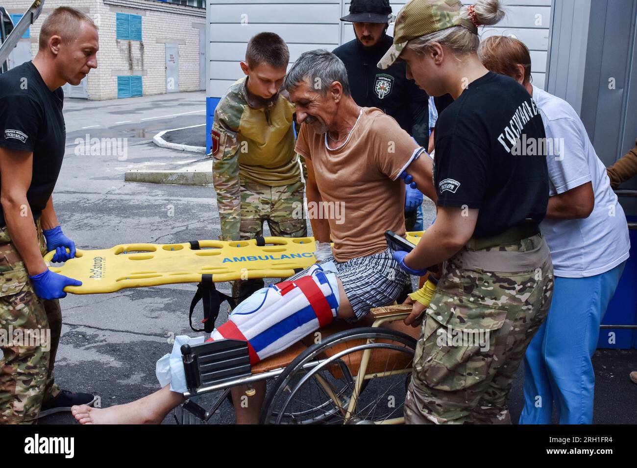 Volunteers of Hospitallers paramedic organisation move an injured ...