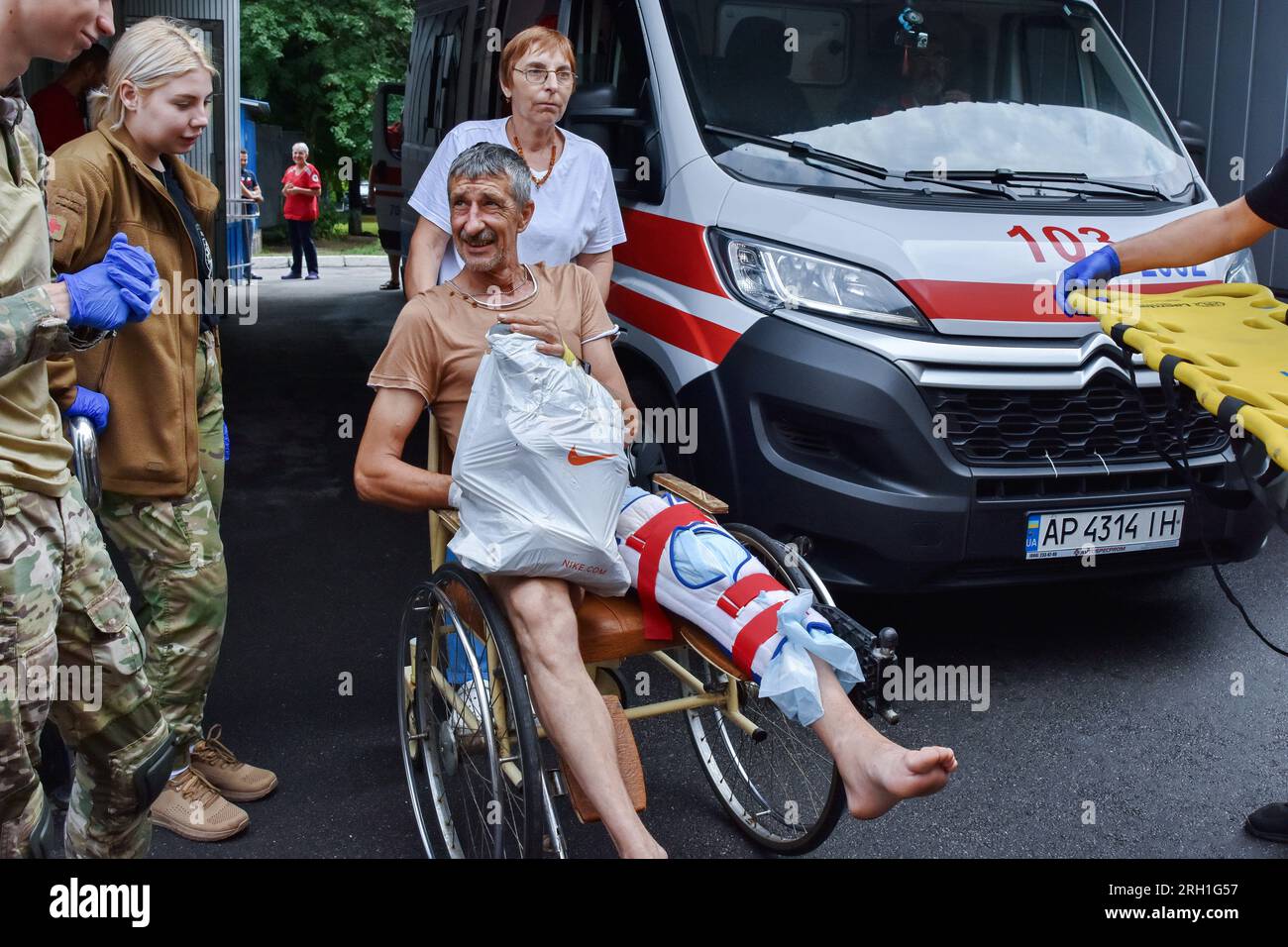 Volunteers of Hospitallers paramedic organisation move an injured ...