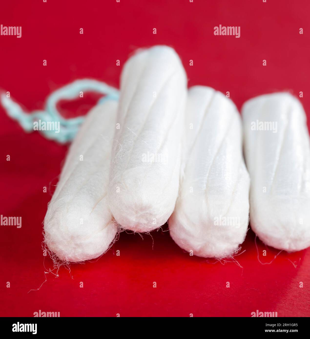 white feminine hygiene products on a red background, feminine hygiene ...