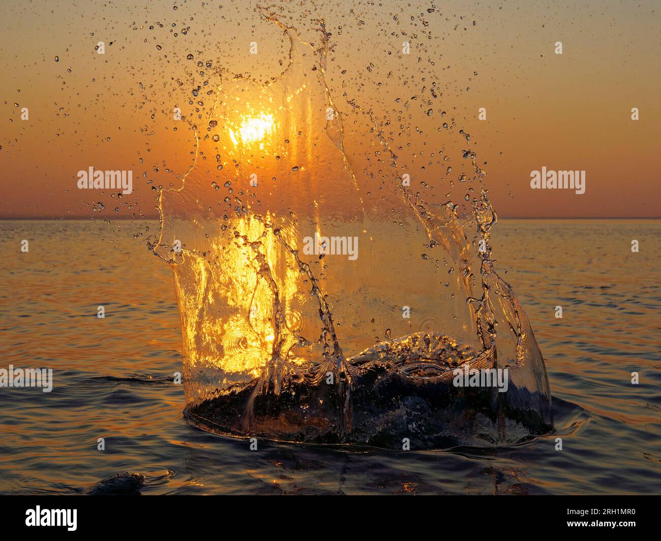 Water fountain at sunset Stock Photo - Alamy