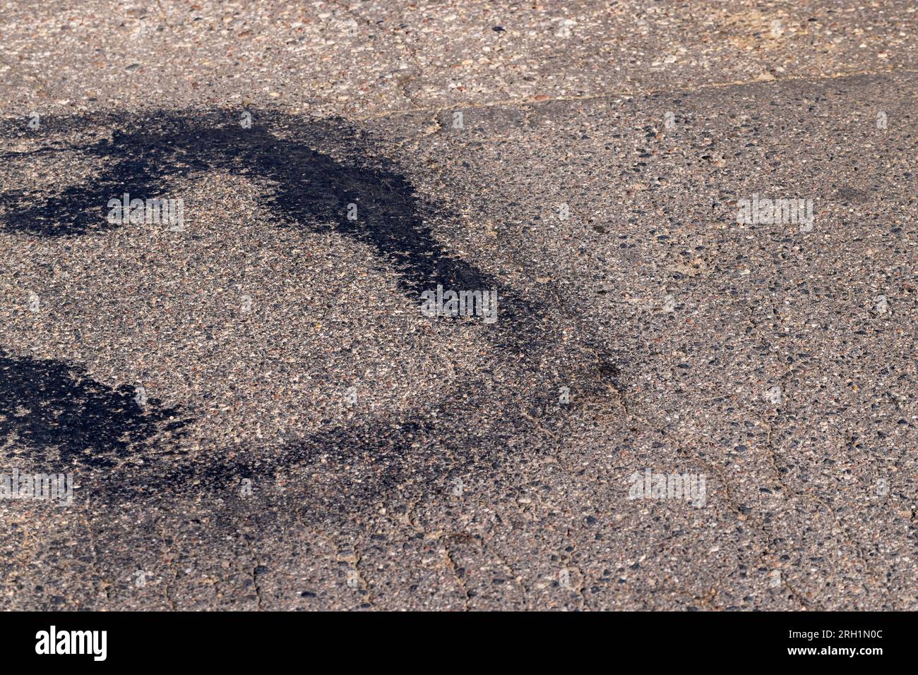 a highway with oil stains on the surface, a polluted highway from ...