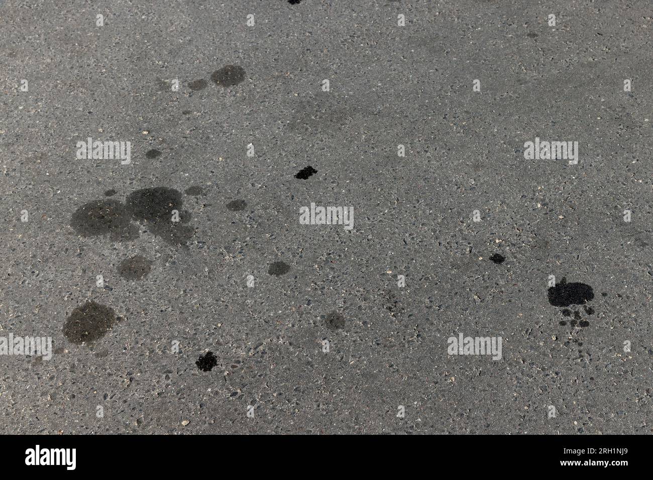 a highway with oil stains on the surface, a polluted highway from ...
