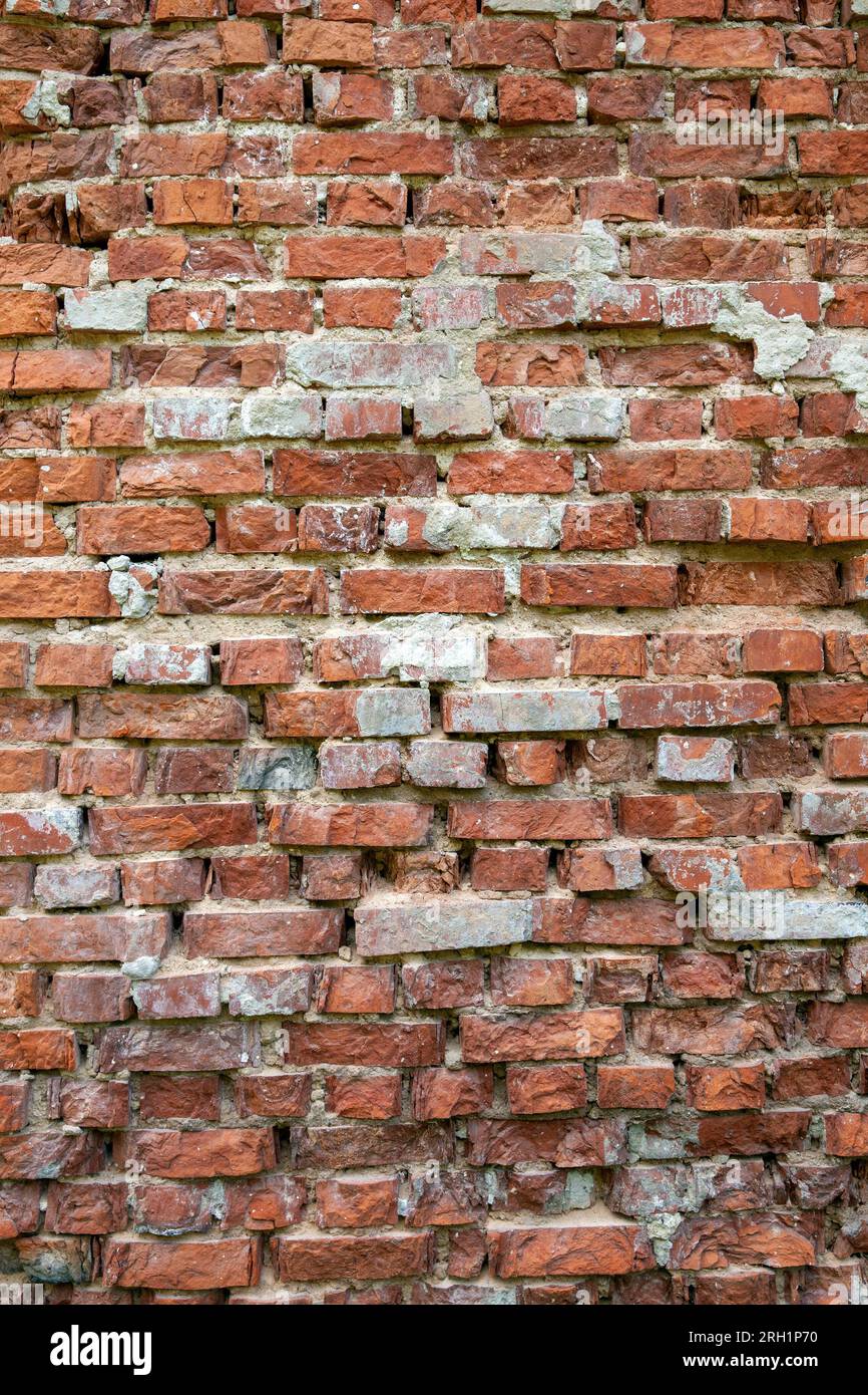 an old crumbling wall of a building, a part of the wall of a building ...