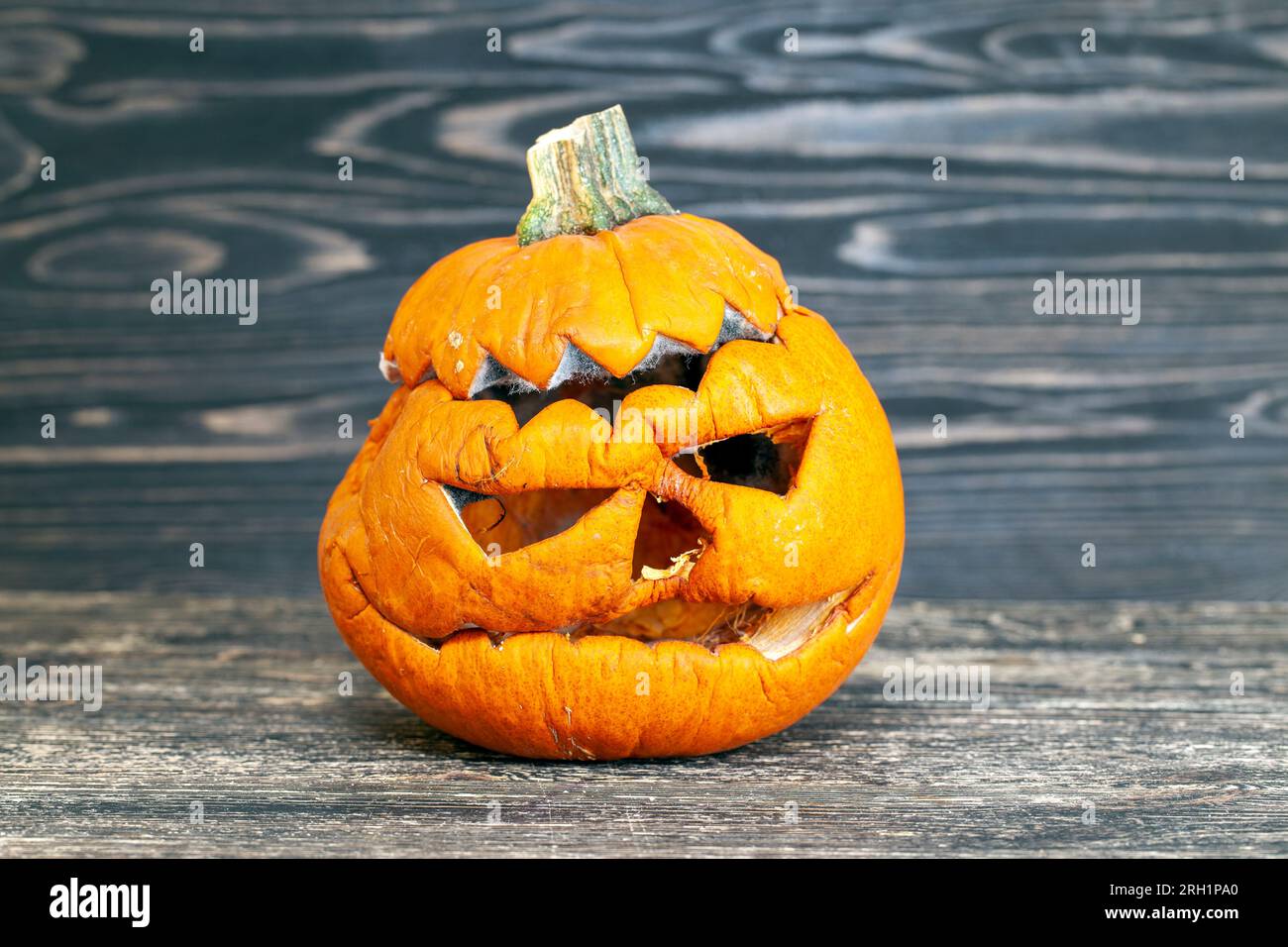 rotting pumpkin head for halloween, carved from pumpkin frightening ...