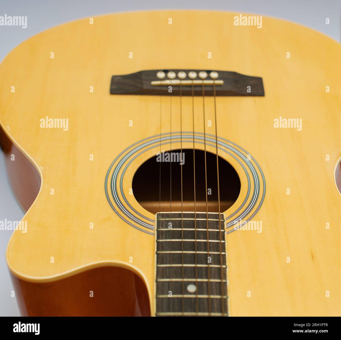 Acoustic guitar isolated on white background Stock Photo - Alamy