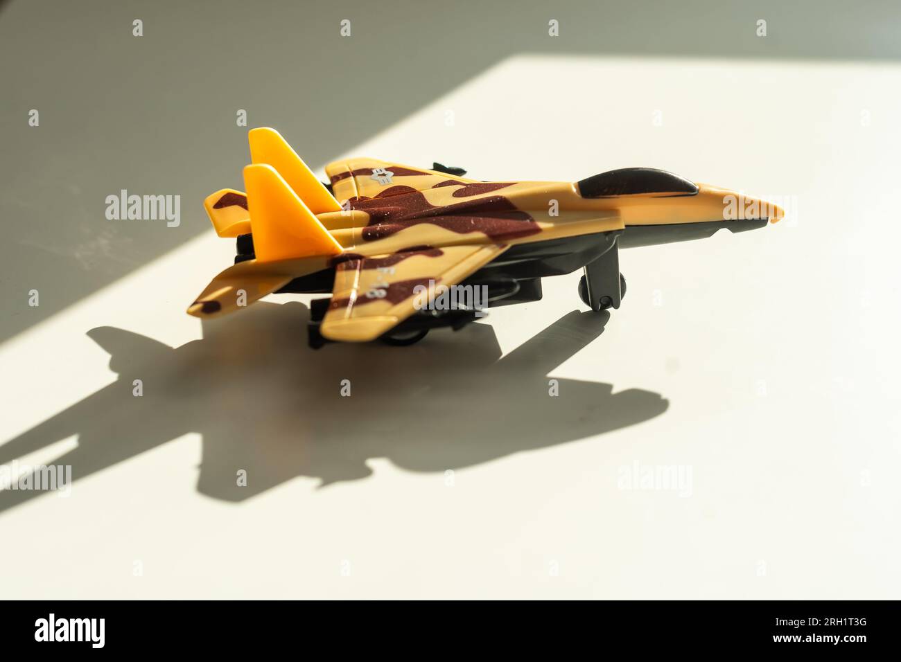 toy soldier plane pale yellow isolated on white background Stock Photo ...