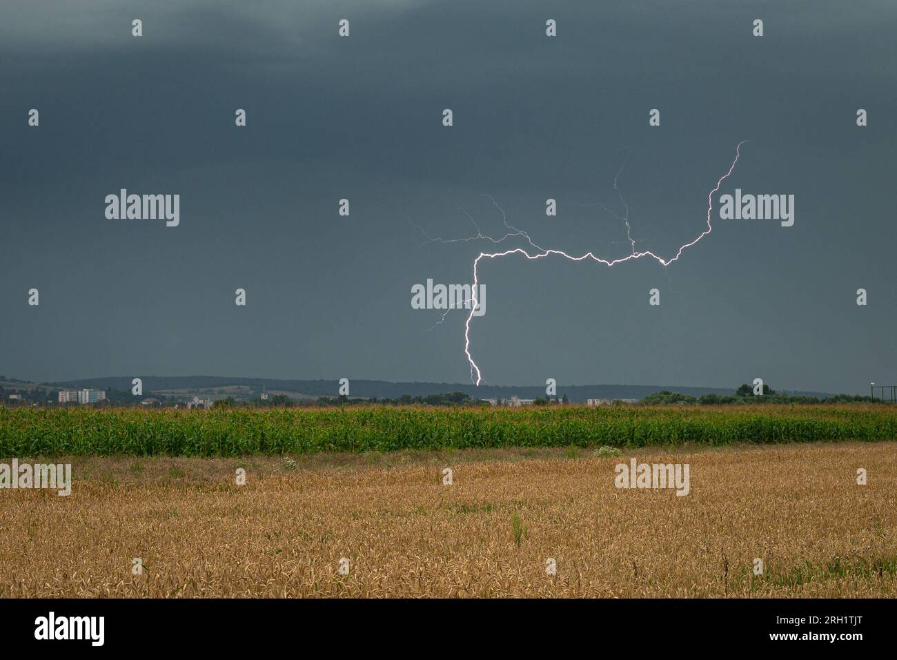 Remarkably shaped lightning discharge over the countryside at daytime ...