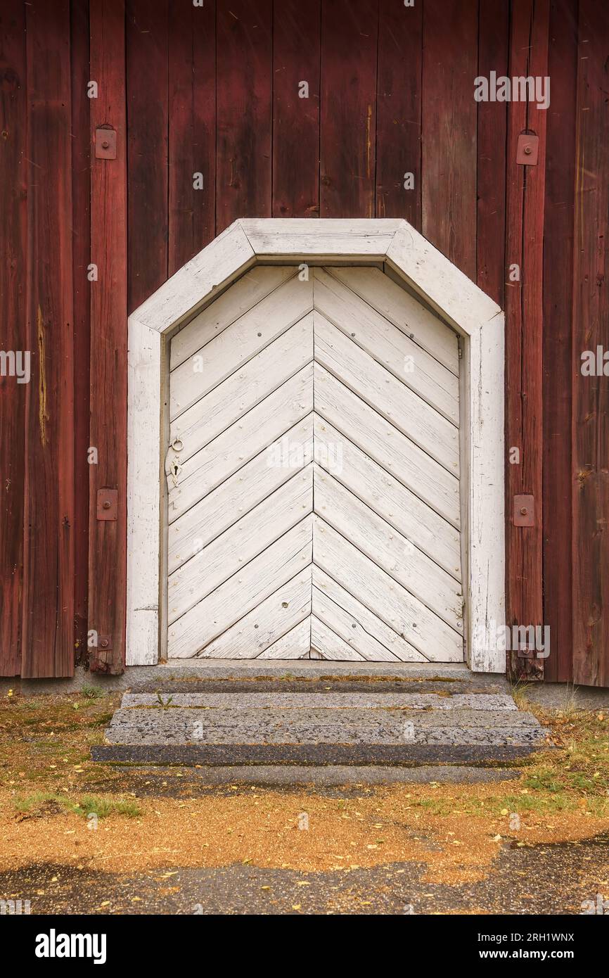 Old white wooden door on a red wooden building in Finland Stock Photo ...