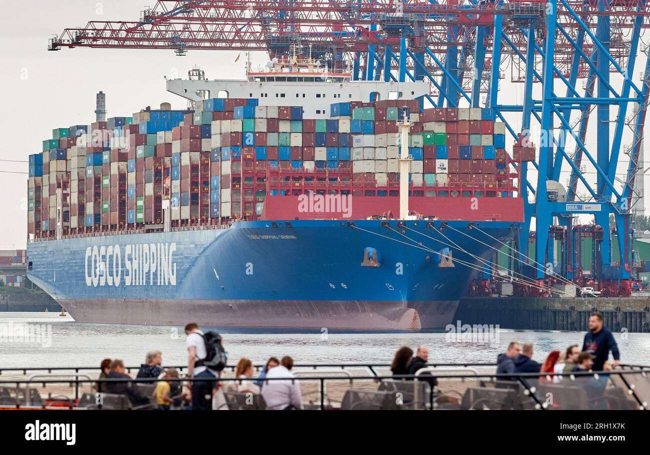 Hamburg, Germany. 13th Aug, 2023. A container ship labeled "Cosco Shipping" lies on the quay at ...