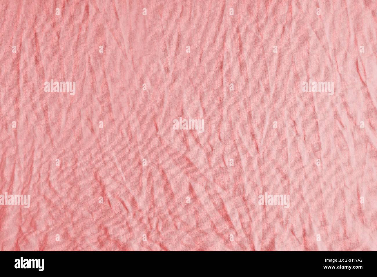 Wrinkled, crumpled red fabric texture background. Wrinkled and creased ...
