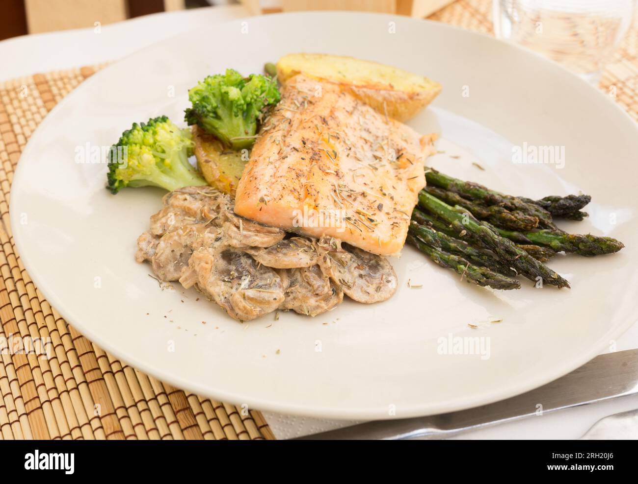 Fried trout fillet dish with broccoli side dish Stock Photo - Alamy