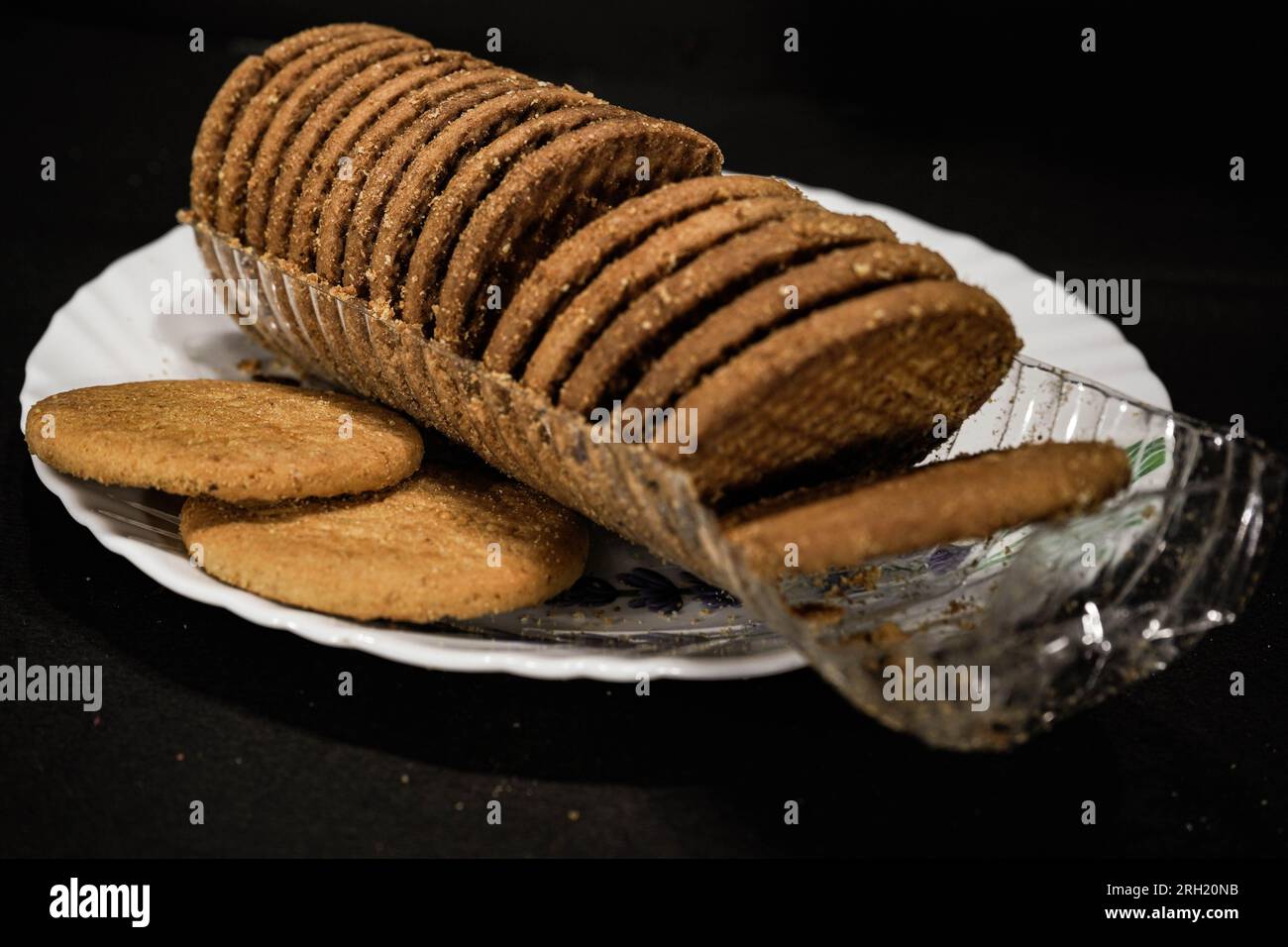 Wheat biscuits in the white melamine plate with black background ...