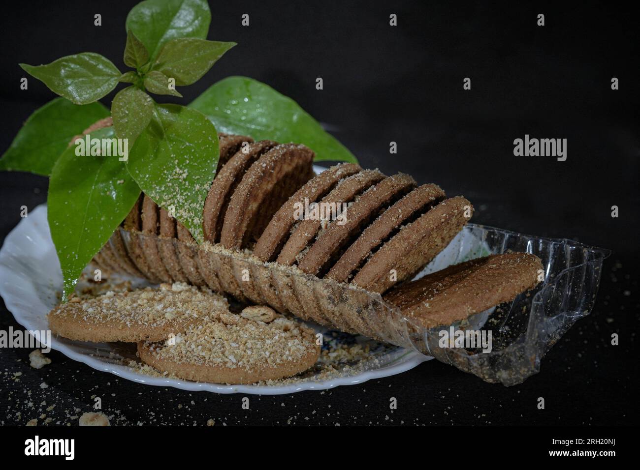 Wheat biscuits in the white melamine plate with black background ...