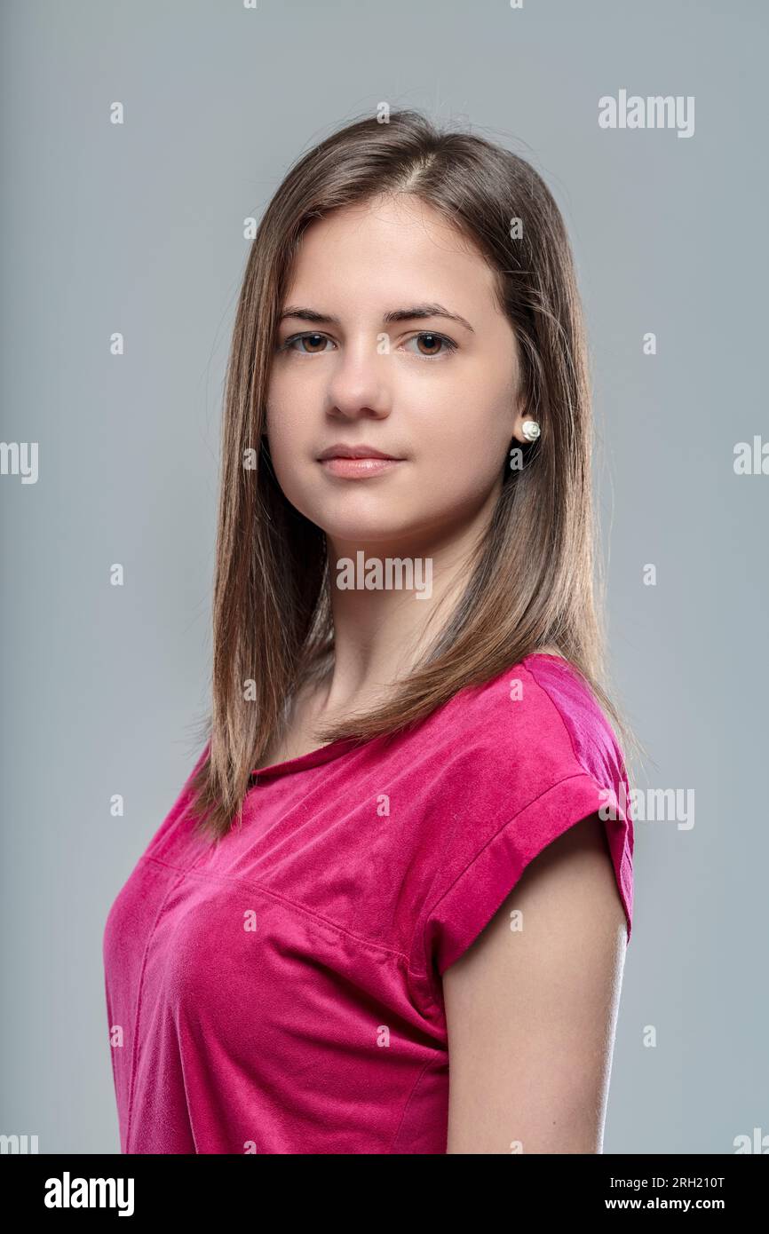 normal-looking woman with medium-length brown hair, lightly smiling ...