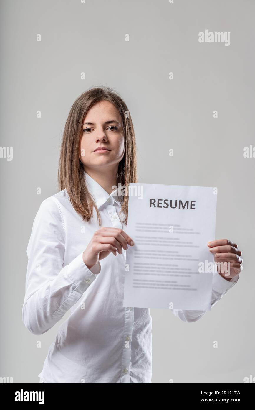 Woman with upright stance shows curriculum; job offer or candidate's ...