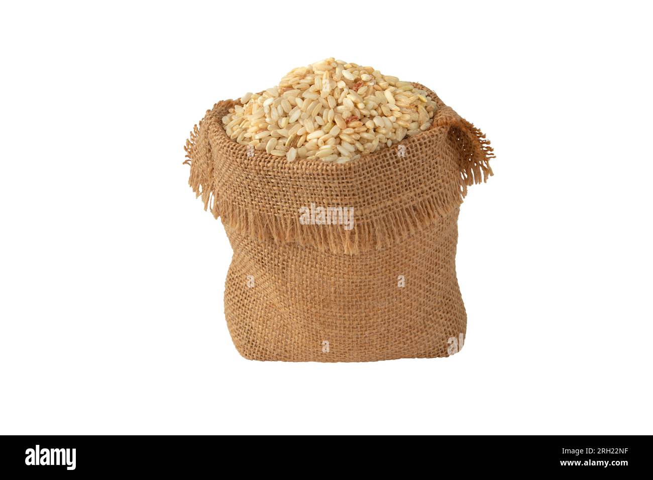 Brown whole grain rice in the jute canvas sack side view isolated on ...