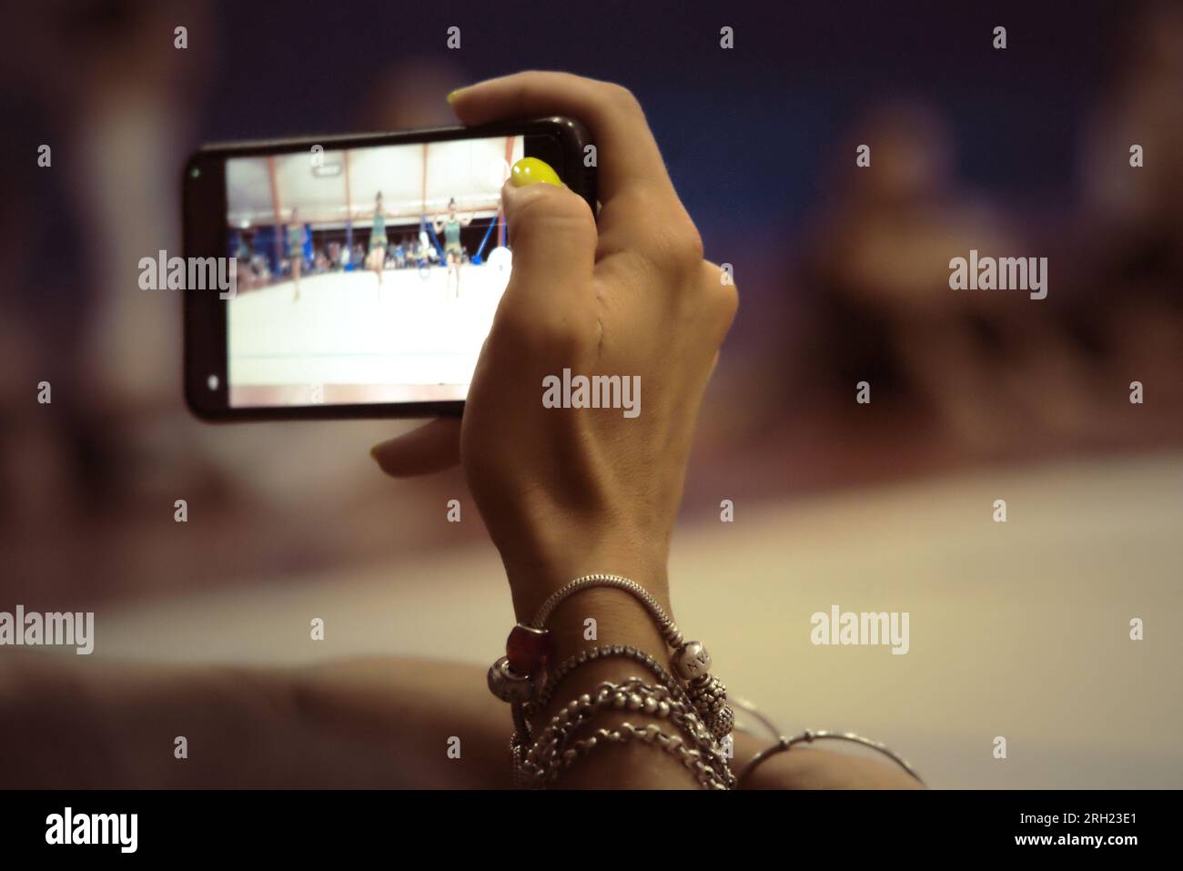 filming a rhythmic gymnastics competition with a mobile phone Stock ...
