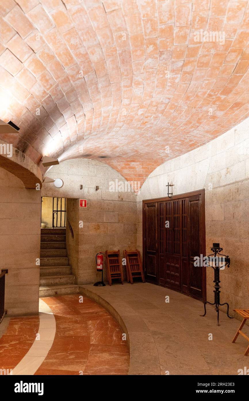 interior view of underground vault with curved brick ceiling in church ...