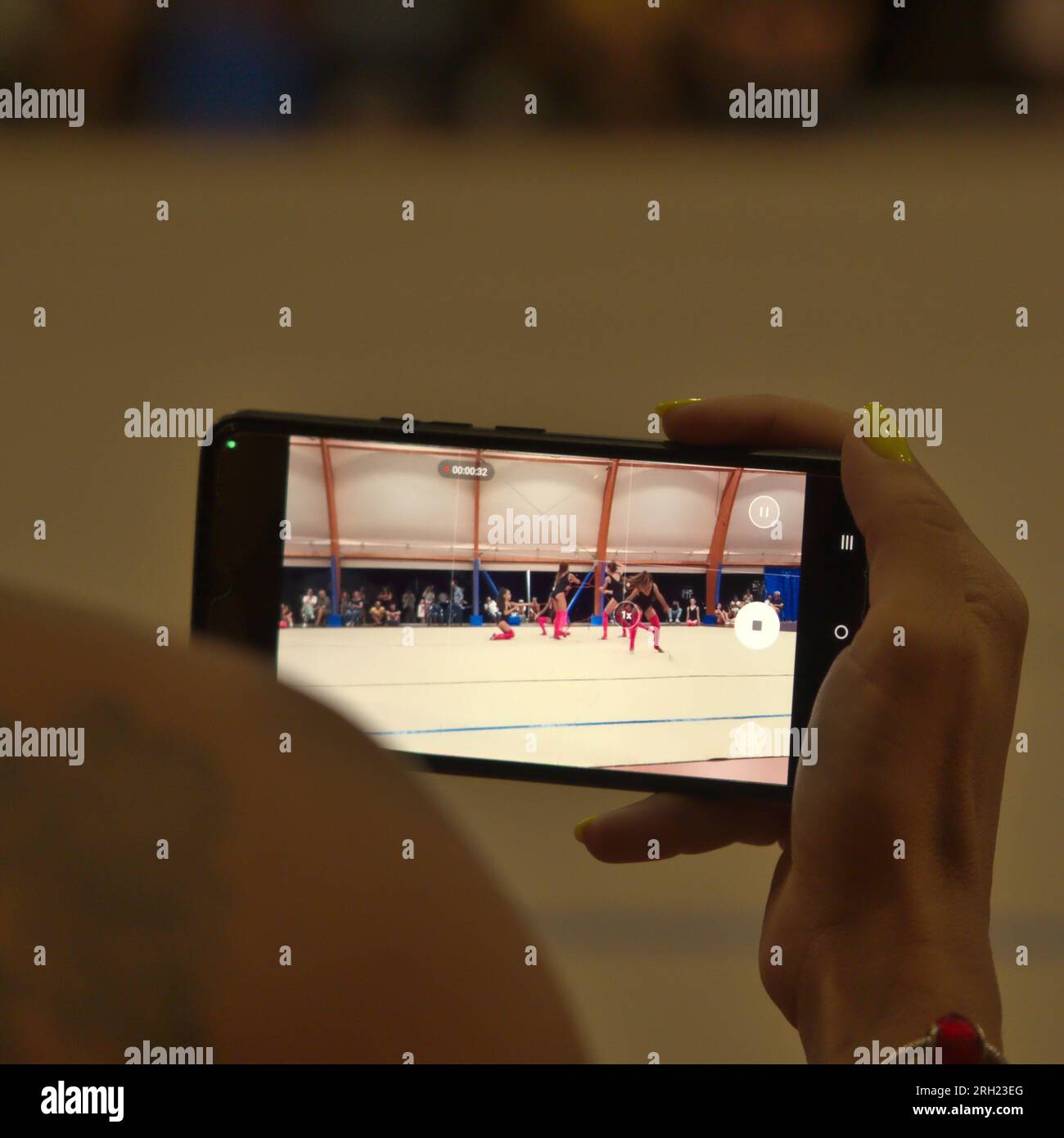 filming a rhythmic gymnastics competition with a mobile phone Stock ...
