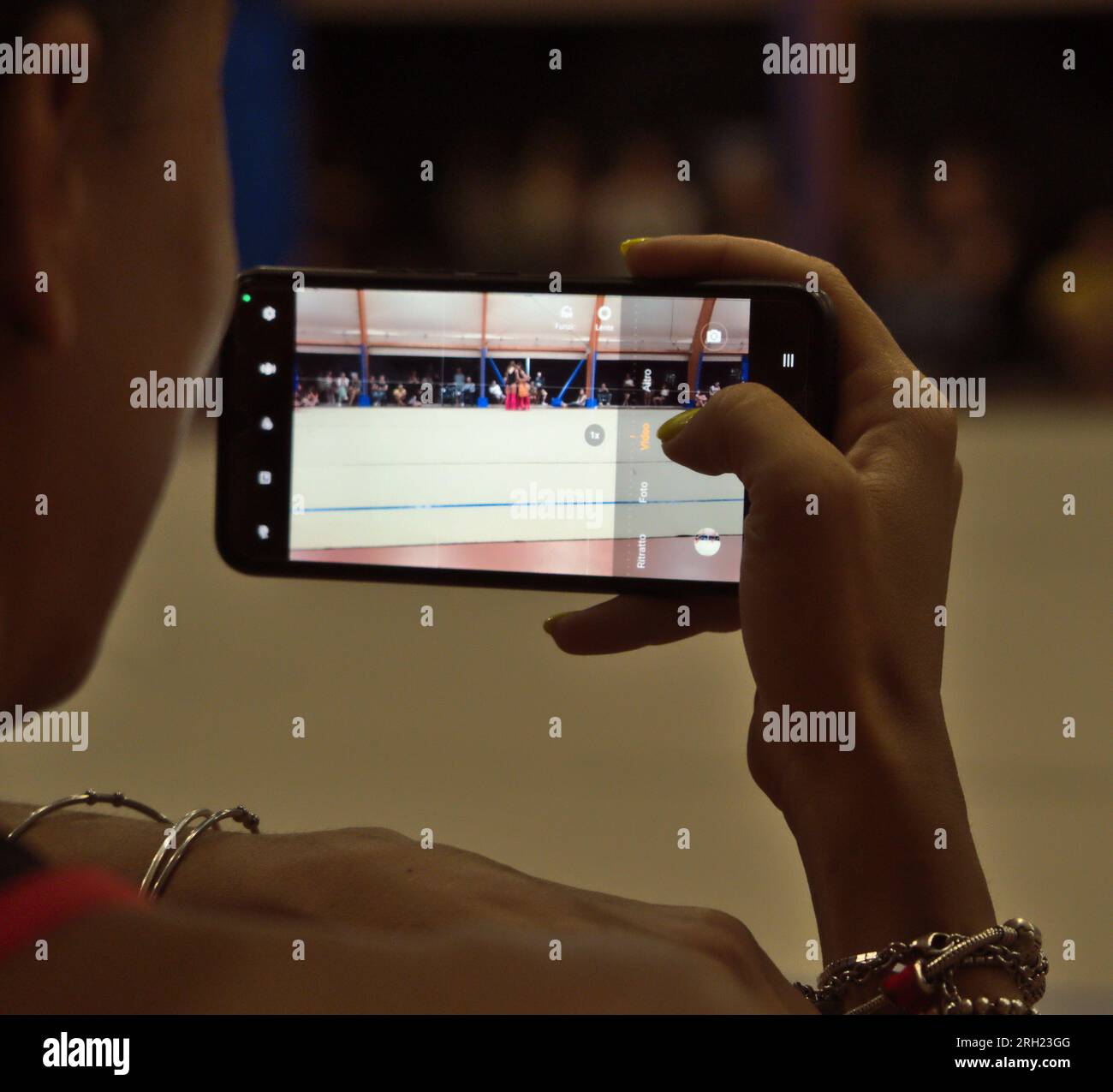 filming a rhythmic gymnastics competition with a mobile phone Stock ...