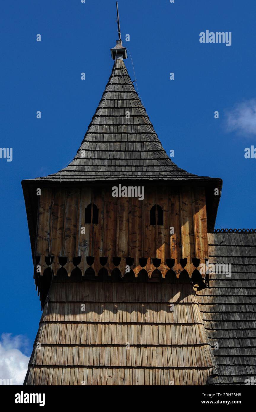 Church tower with projecting or overhanging bell chamber at base of ...