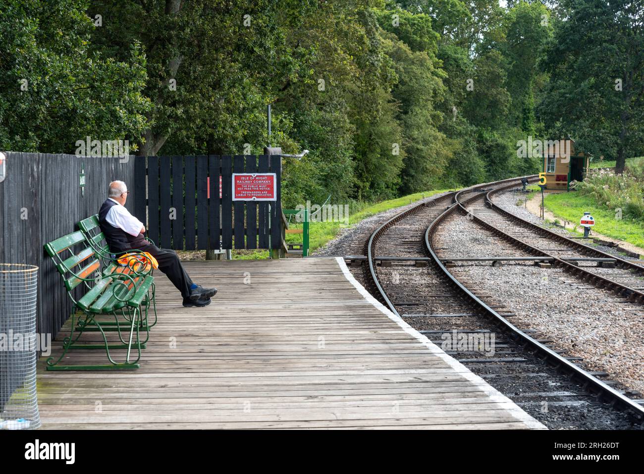 Smallbrook station platform on the Isle of Wight. Guard waiting here to ...