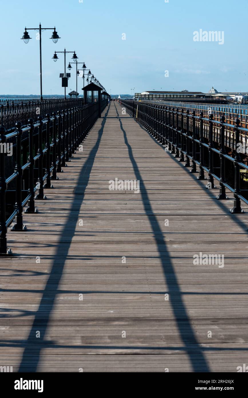 Pedestrian walkway along Ryde pier on the Isle of Wight, looking ...
