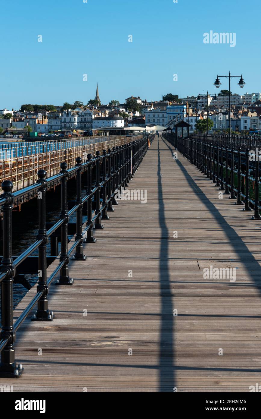 Pedestrian walkway along Ryde pier on the Isle of Wight looking back to ...