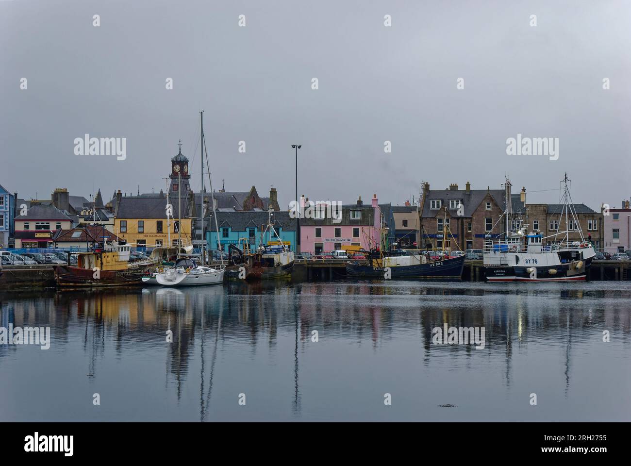 Colourful Buildings line the Waterfront behind the Fishing Boats moored ...