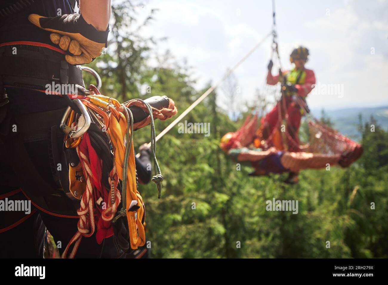 Paramedic with patient in stretcher under helicopter. Teams of ...