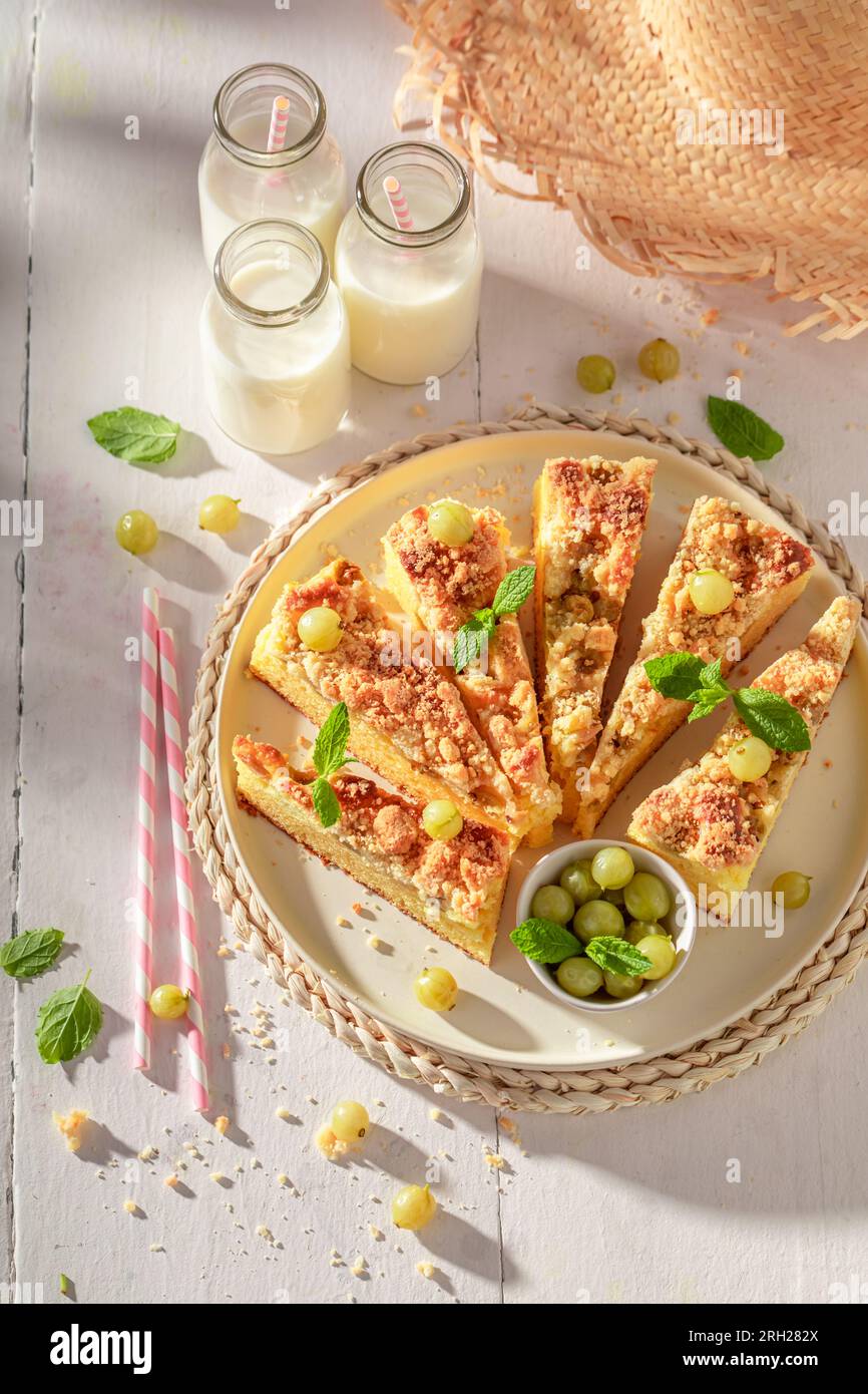 Tasty gooseberry butter cake with glaze and crumble. Yeast cake served ...
